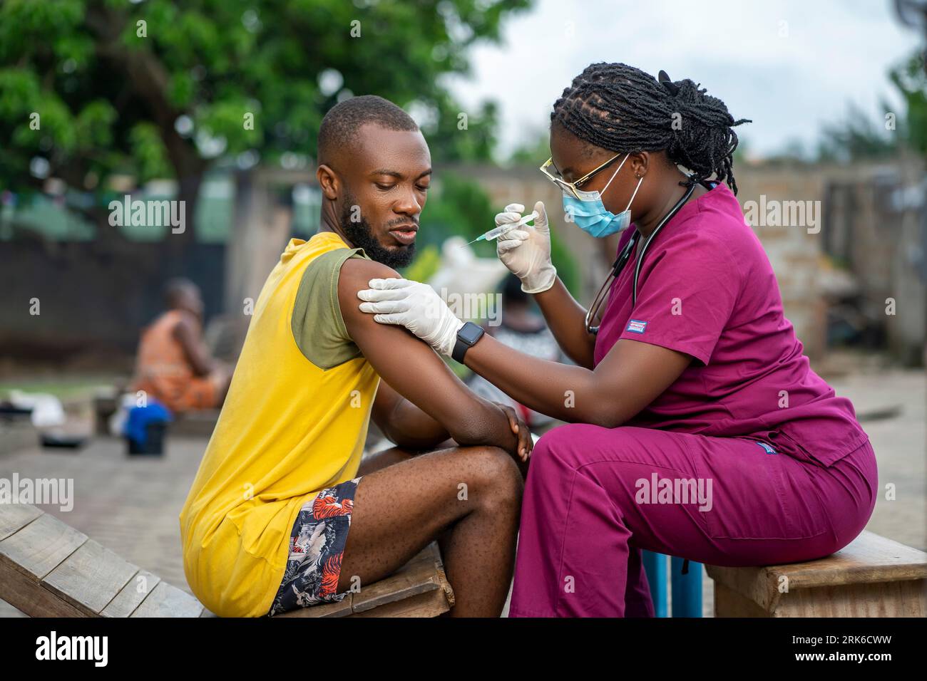 A young African nurse with a patient in a home care service Stock Photo - Alamy