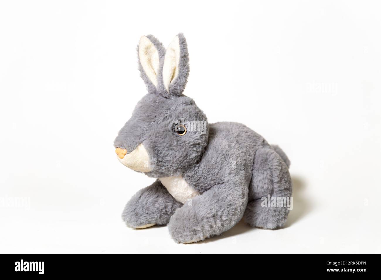 Plush gray bunny toy isolated on a white background, ideal for ...