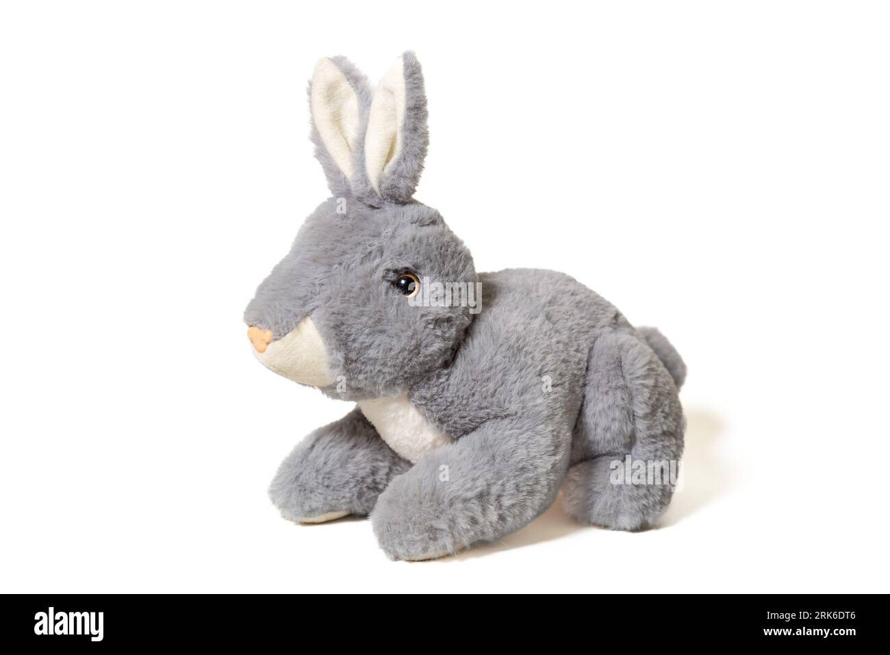 A small, plush gray bunny toy isolated on a white background, perfect ...