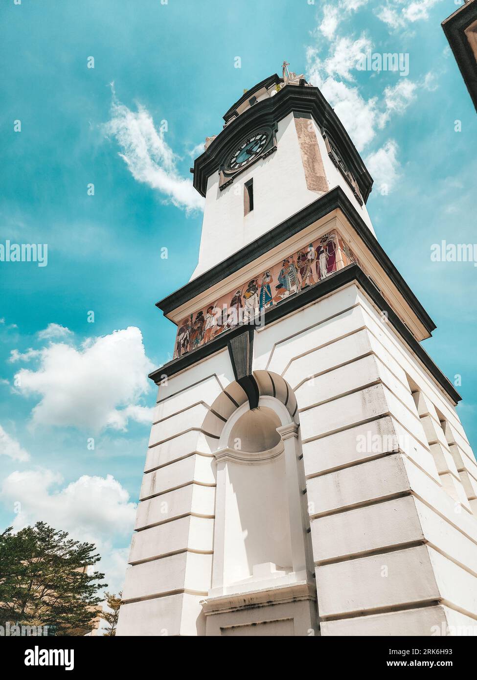 A low angle of a white Clock Tower in Malaysia Stock Photo - Alamy