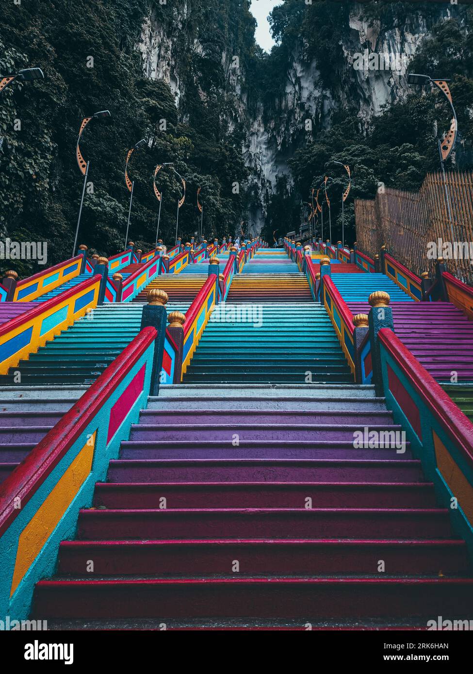 A low angle of rainbow-colored staircase with at Batu Caves in Kuala ...