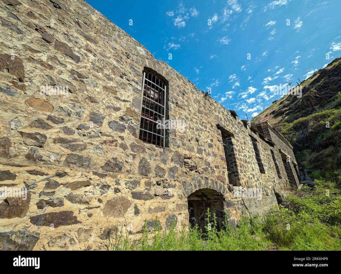Barred windows and stone walls of the abandoned powerhouse at White ...
