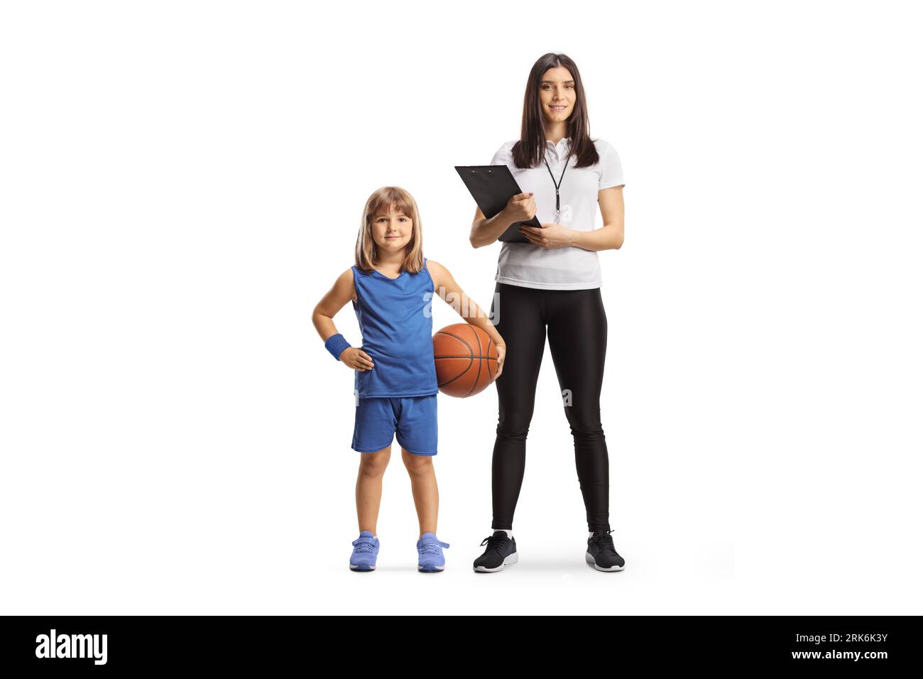 Female basketball coach standing with a girl in a sports jersey ...