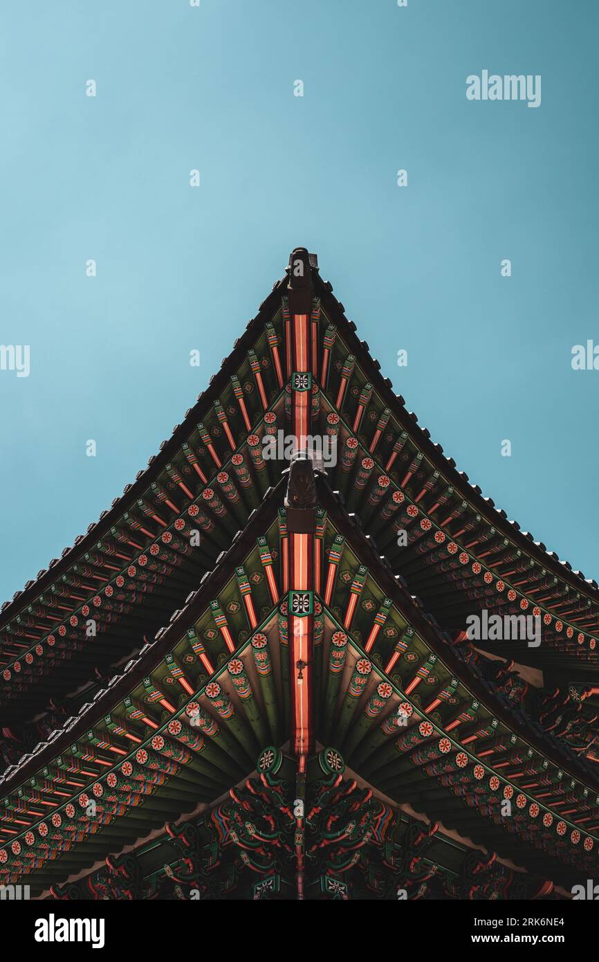 A vertical shot of a traditional Korean building under the sunlight and ...