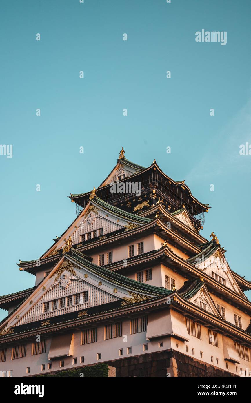 A vertical shot of the Osaka Castle in the daylight in Japan Stock ...