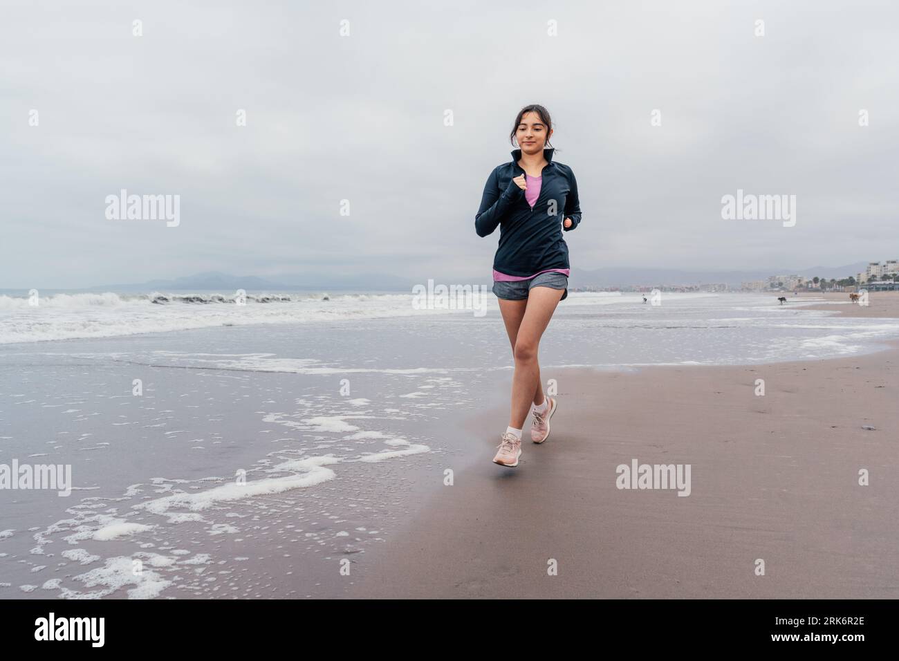 Woman running exercise beach hi-res stock photography and images - Alamy