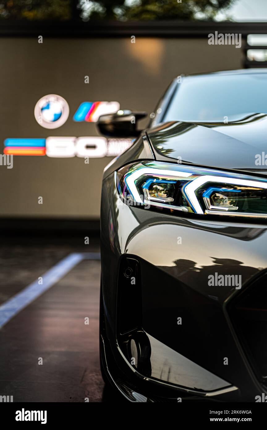 A BMW car is seen on display at a dealership surrounded by other BMW ...
