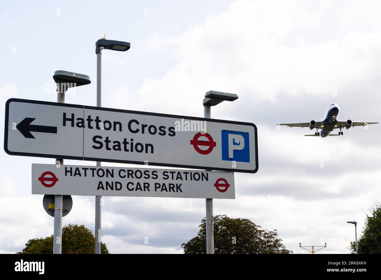 Hatton Cross station sign with jet airliner plane on finals to land at ...