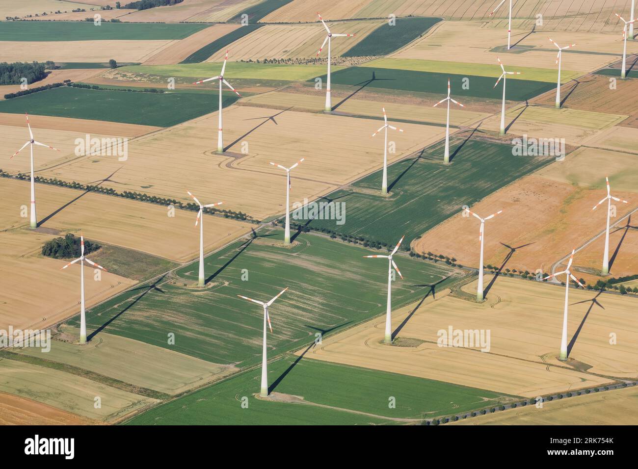 Aerial view of wind turbines farm in Saxony-Anhalt, Germany. Wind power plant and farmland in ...