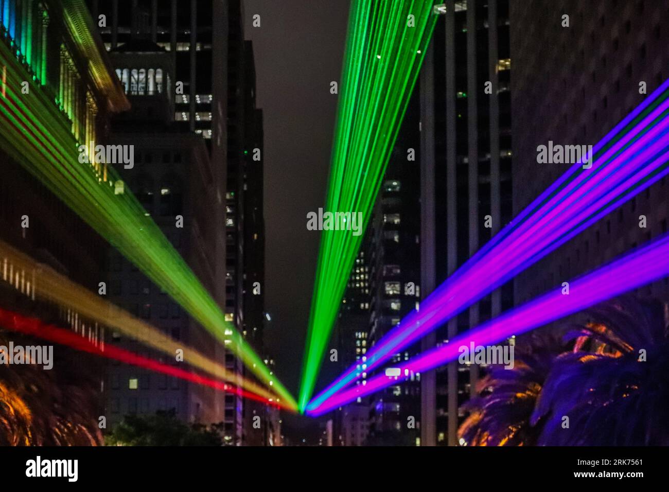 A rainbow laser light display at night during Pride month in San ...