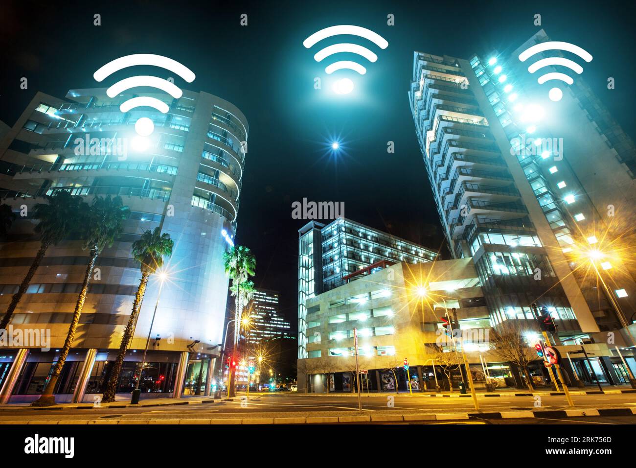 Cityscape, internet and night, wireless connectivity with building ...