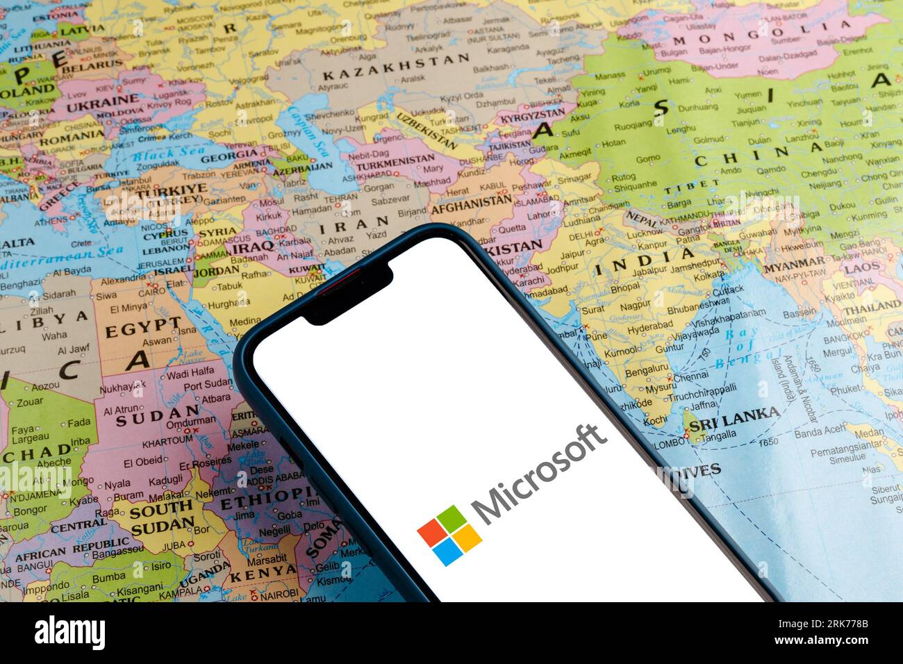 A modern smartphone screen displaying the Microsoft logo Stock Photo ...