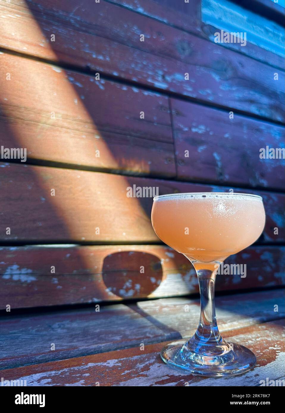 A crystal clear glass filled to the brim with a refreshing, colorful ...