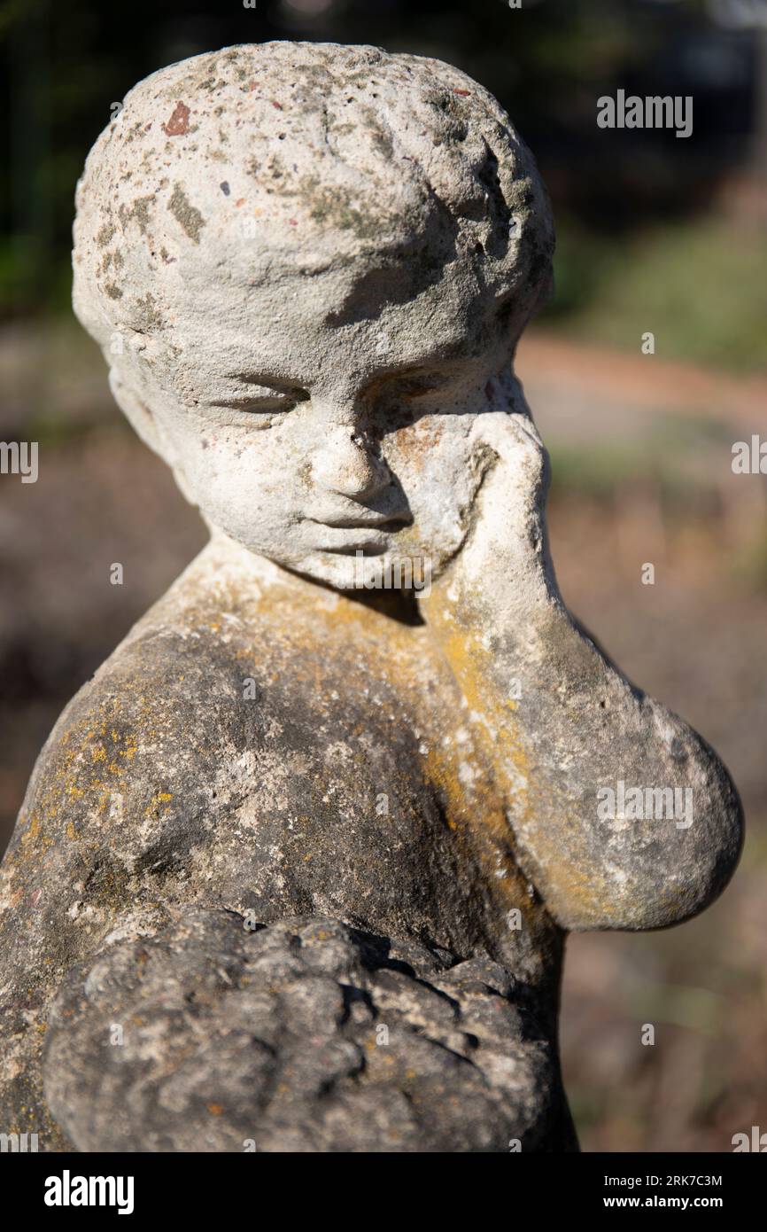 Statue of person with hand on cheek Stock Photo - Alamy