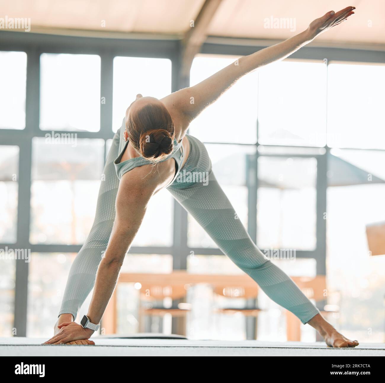 Wellness, gym or woman stretching body or ready to start gymnastics ...