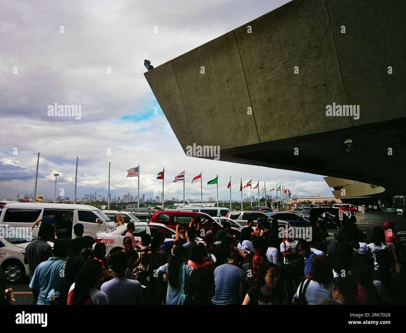 Crowd of people waiting outside Ninoy Aquino International Airport NAIA ...