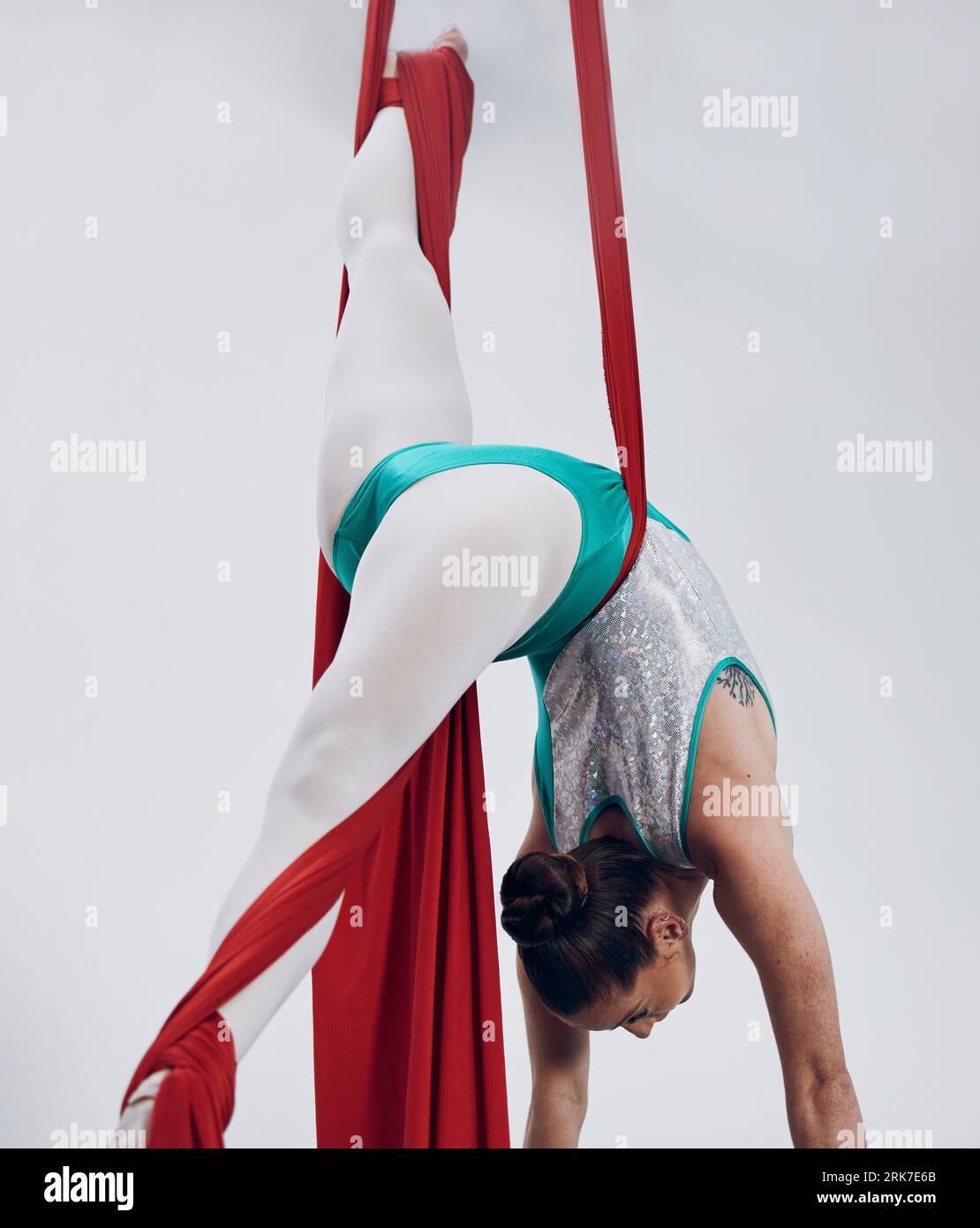 Gymnastics, woman acrobat with fabric and sports, fitness and art with ...