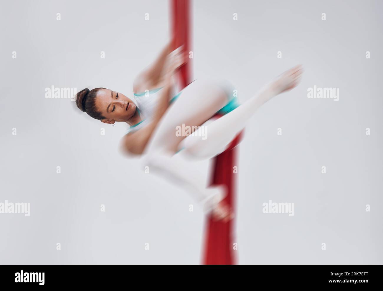 Gymnastics, woman and aerial silk with a acrobat in air for performance ...