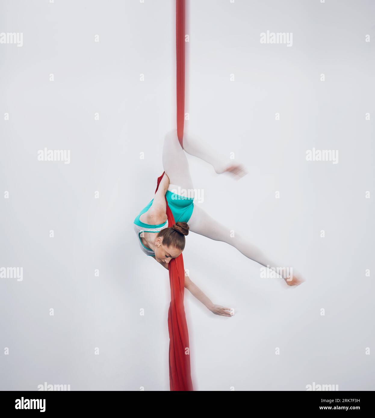 Gymnastics, acrobat and aerial silk with a sports woman in air for ...