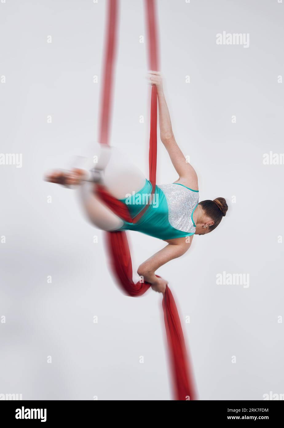 Aerial silk, acrobat and a woman in air for gymnastics performance ...