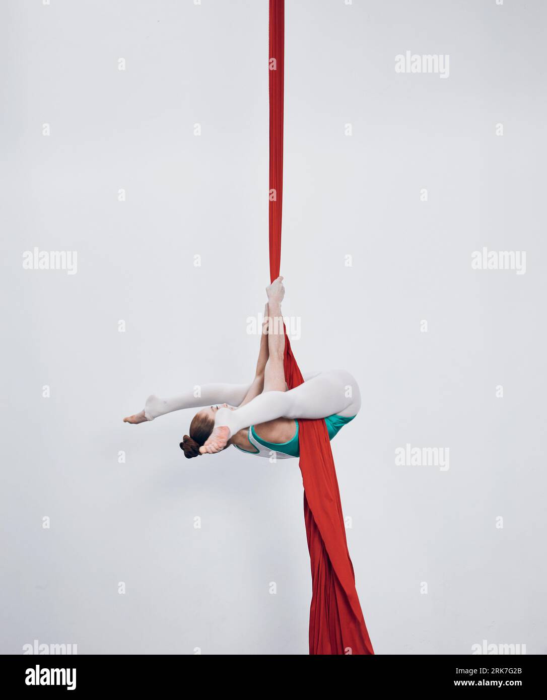 Gymnastics, acrobat and aerial silk with a woman in air for performance ...