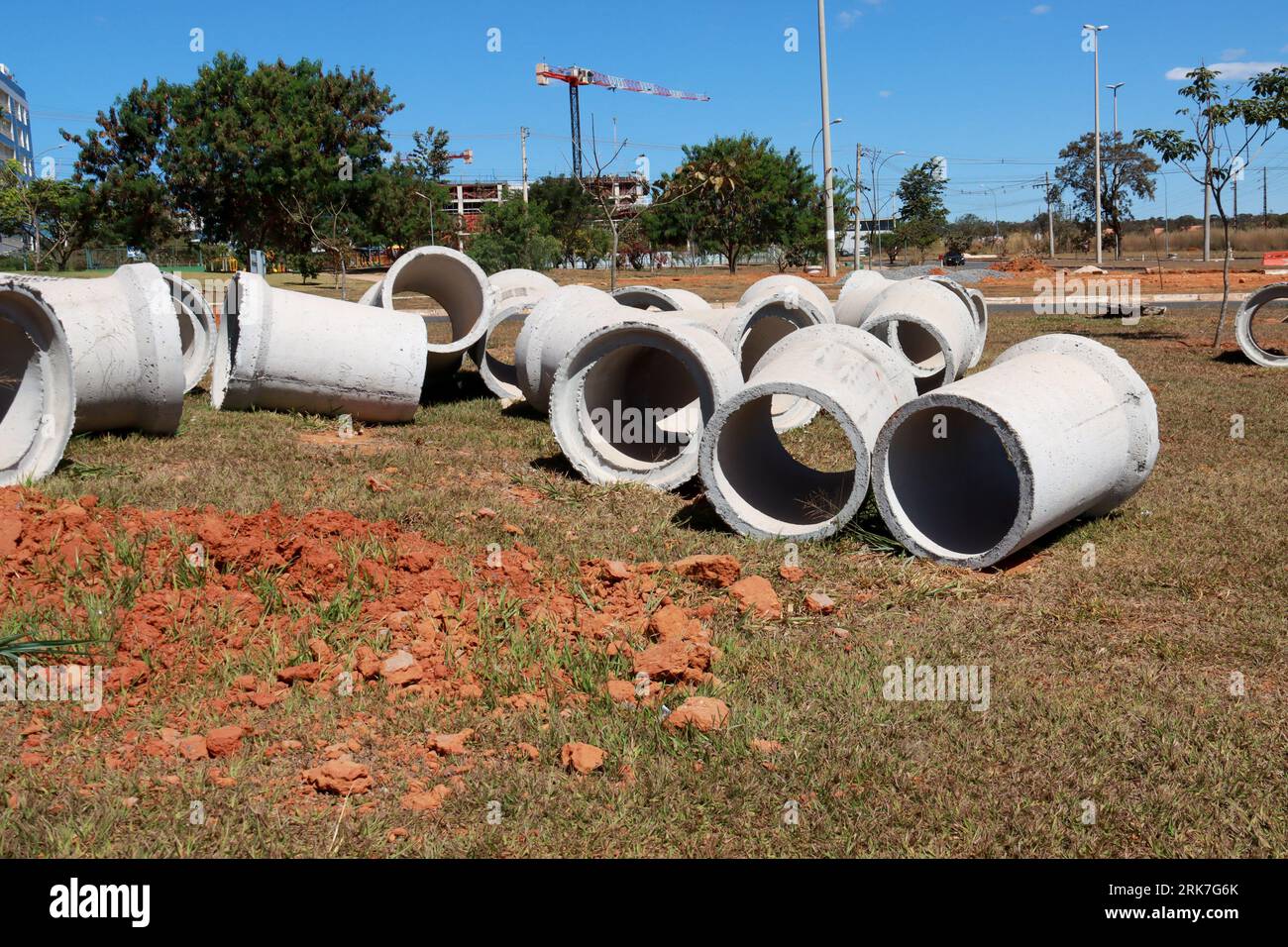 The concrete Sewer pipes laid out on the grass waiting to be installed ...