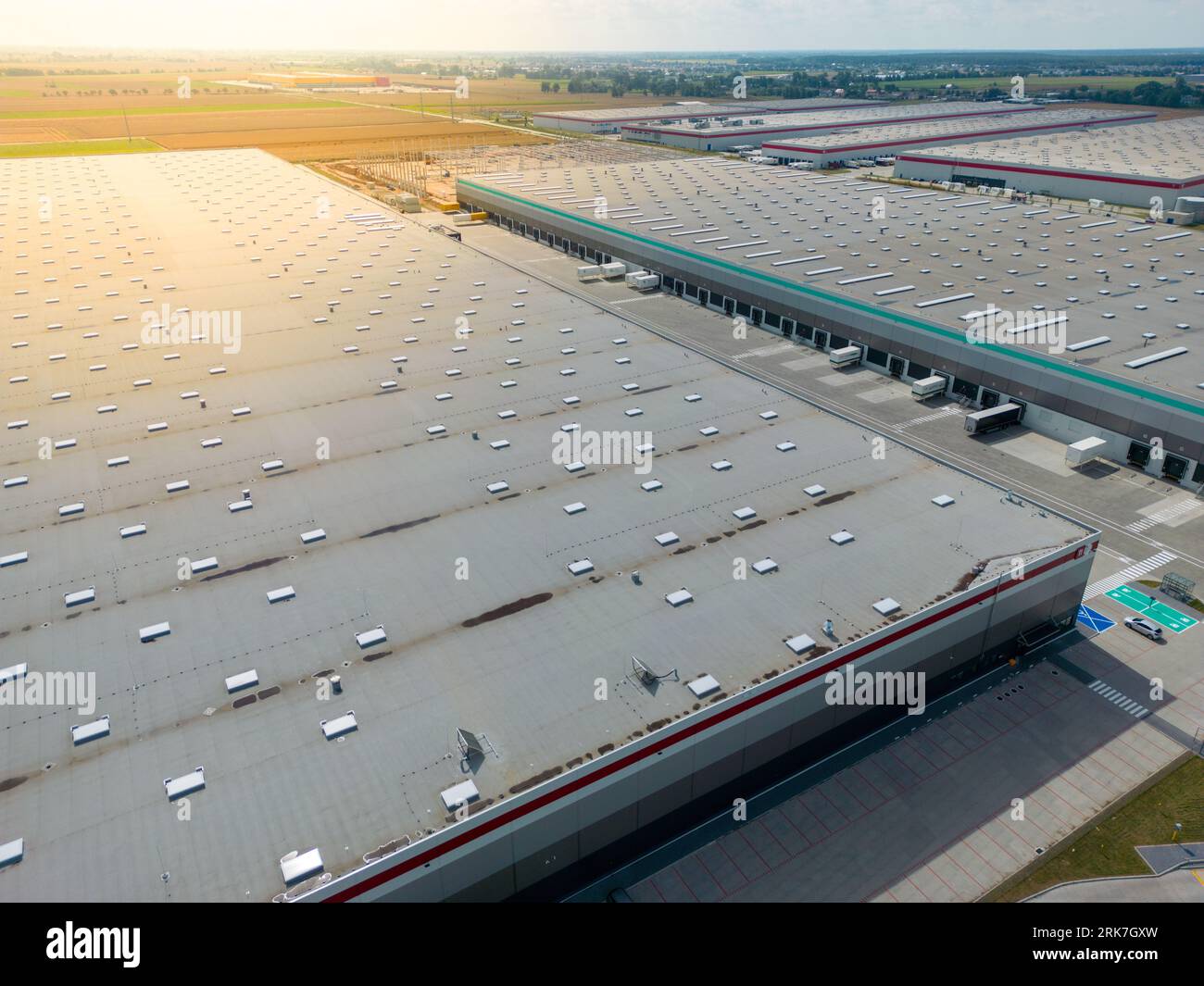An aerial view of a large warehouse complex in the evening with a ...