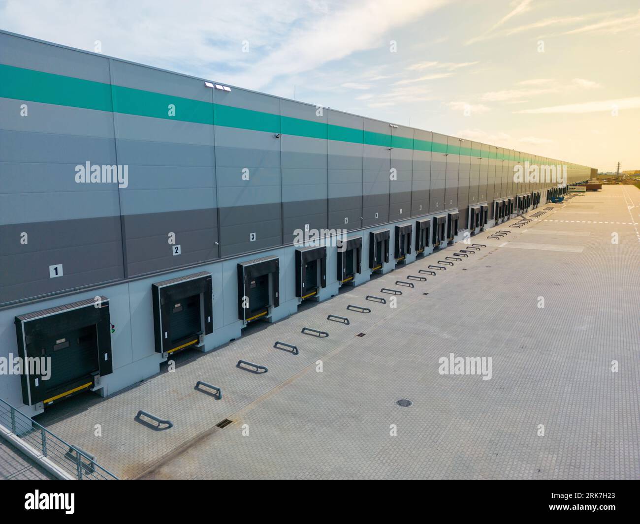 An aerial view of a large warehouse complex in the evening with a ...