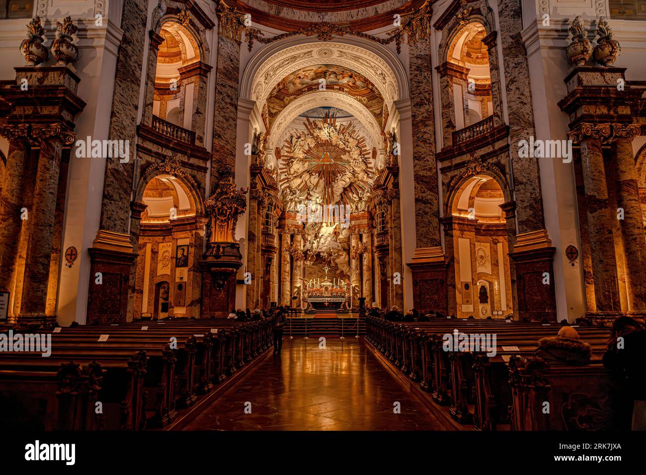 An interior view of a stunning cathedral featuring a golden stained ...