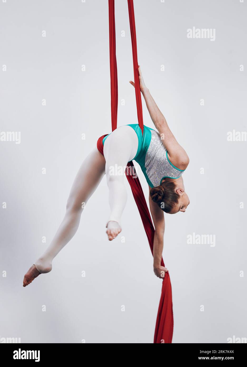 Aerial acrobat, gymnastics and silk of a woman in air for performance ...