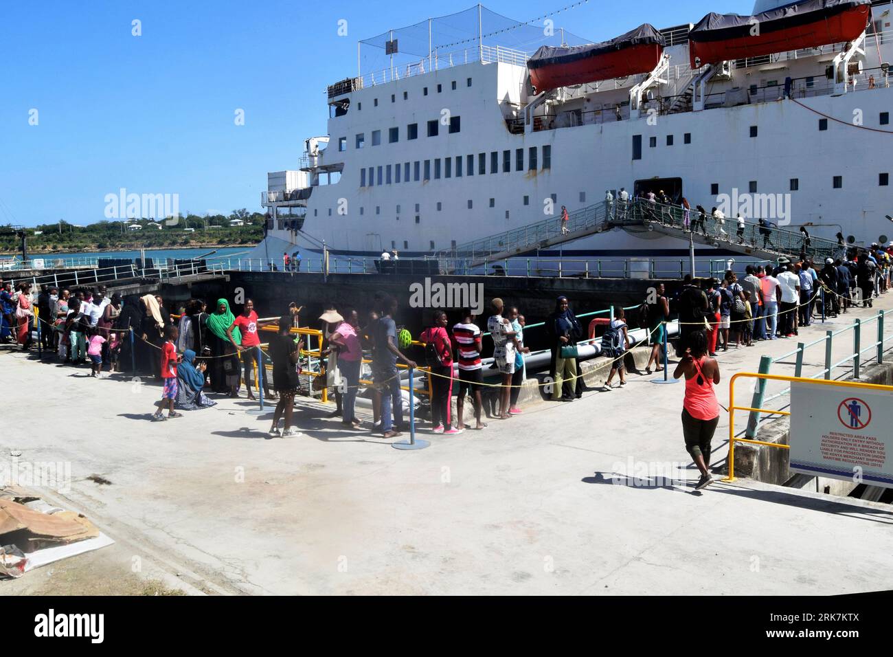 Hundreds of Mombasa residents queue as they wait to board the largest ...