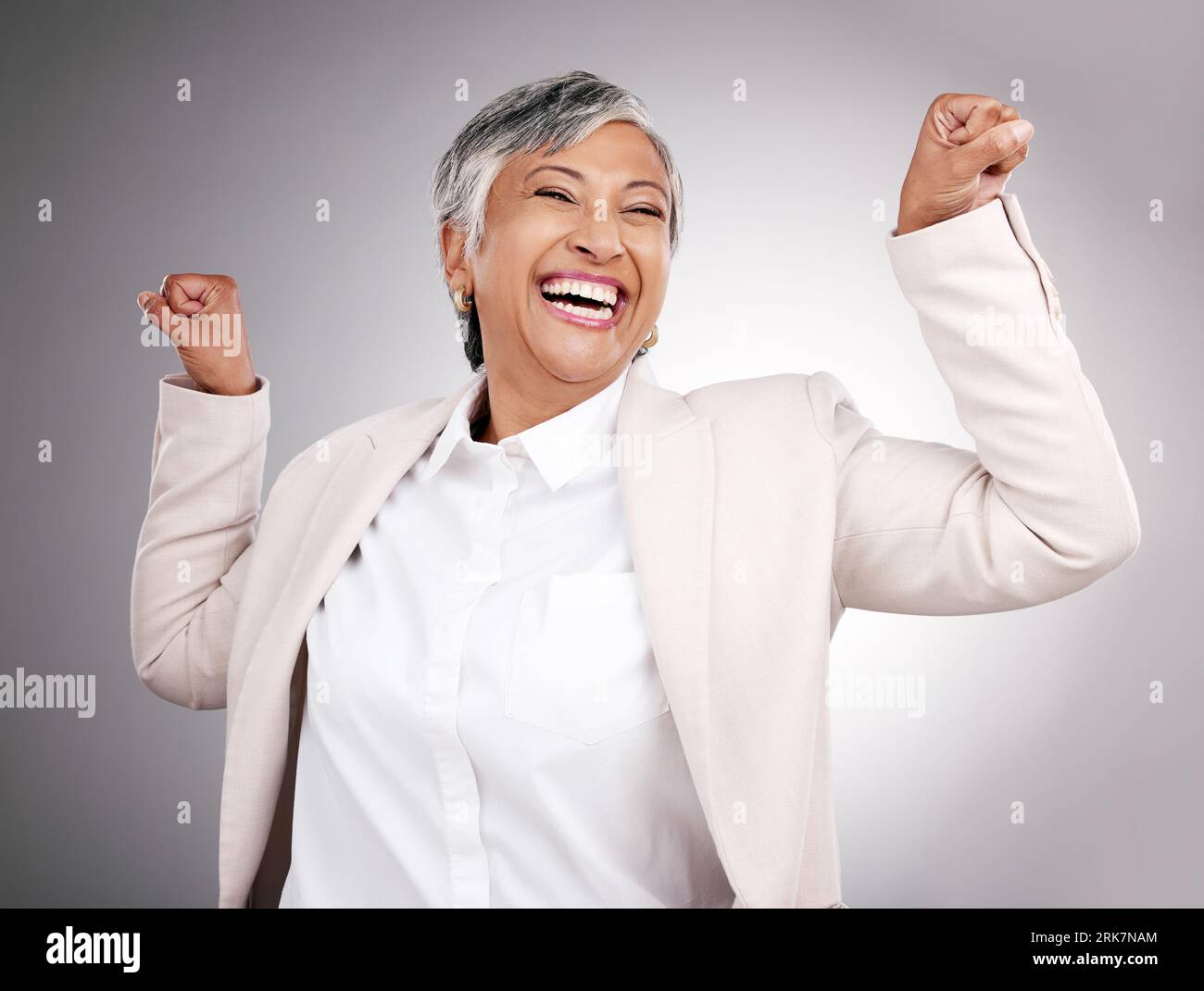 Strong, laughing and portrait of a woman on a studio background for a ...