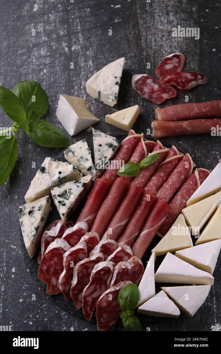 photo slices of several types of sausage and cheese, assortment, wine ...