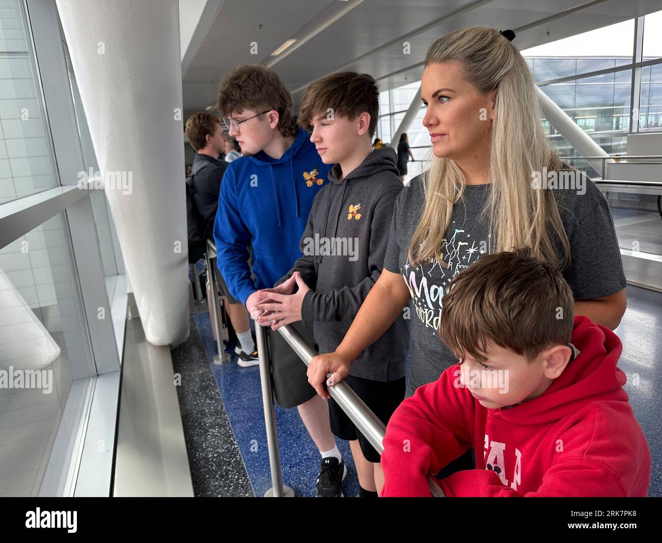 Mitzi Hale and her three sons look out a window at backed-up traffic ...