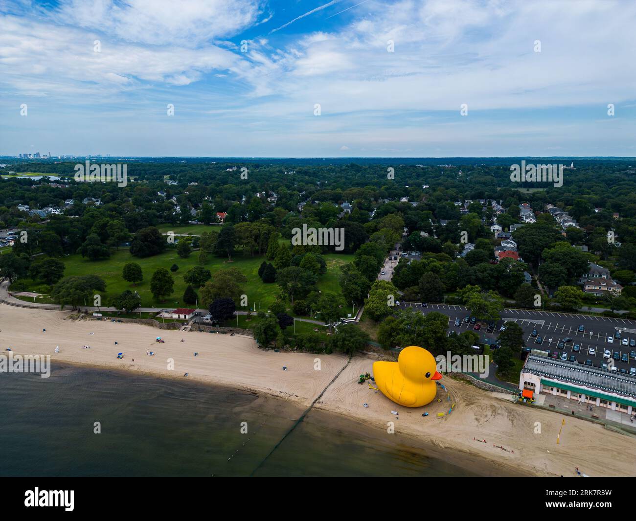 An aerial view of an enormous yellow rubber duck on the beach near the ...