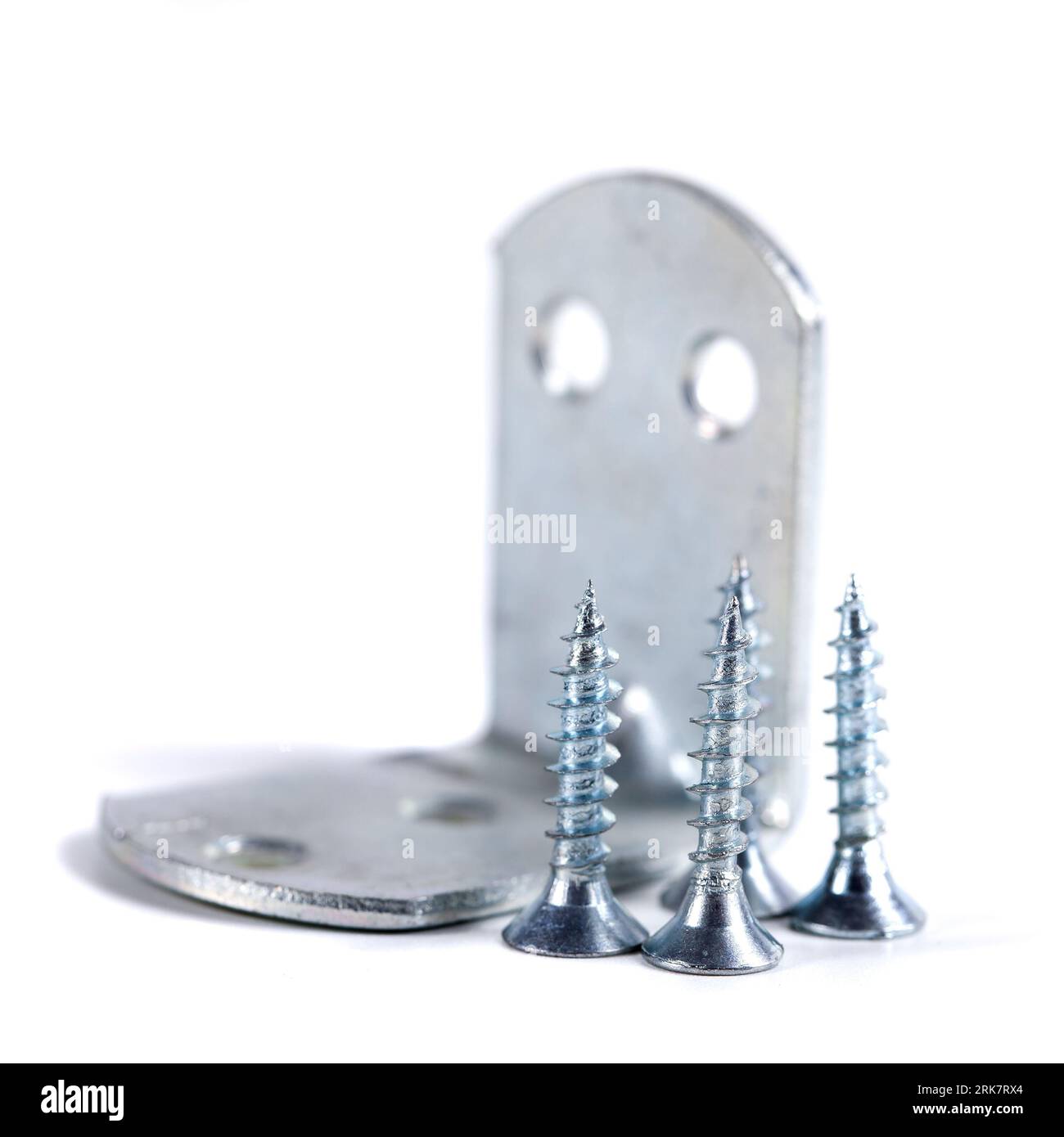 Chrome screw on white background. Self-tapping screws from steel close ...