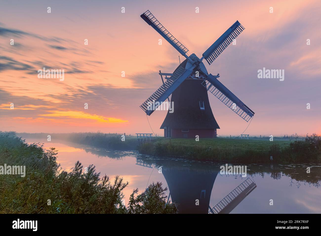 A horizontal photo of a beautiful summer morning with a layer of fog ...