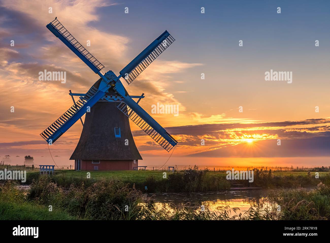 A horizontal photo of a beautiful summer morning with a layer of fog ...