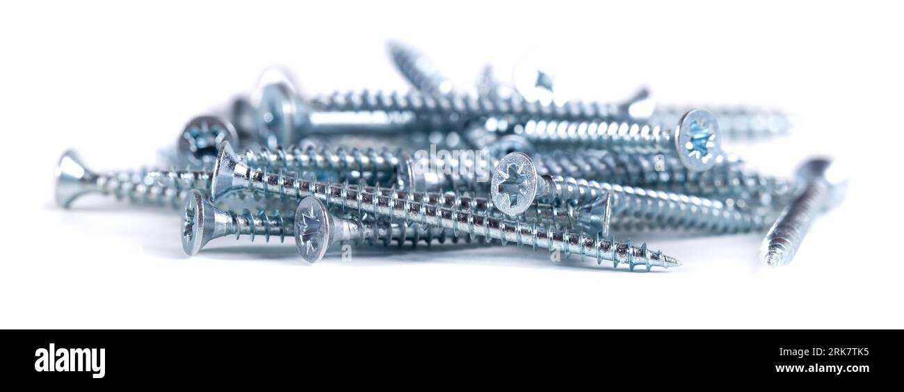 Chrome screw on white background. Tapping screws from steel close-up ...