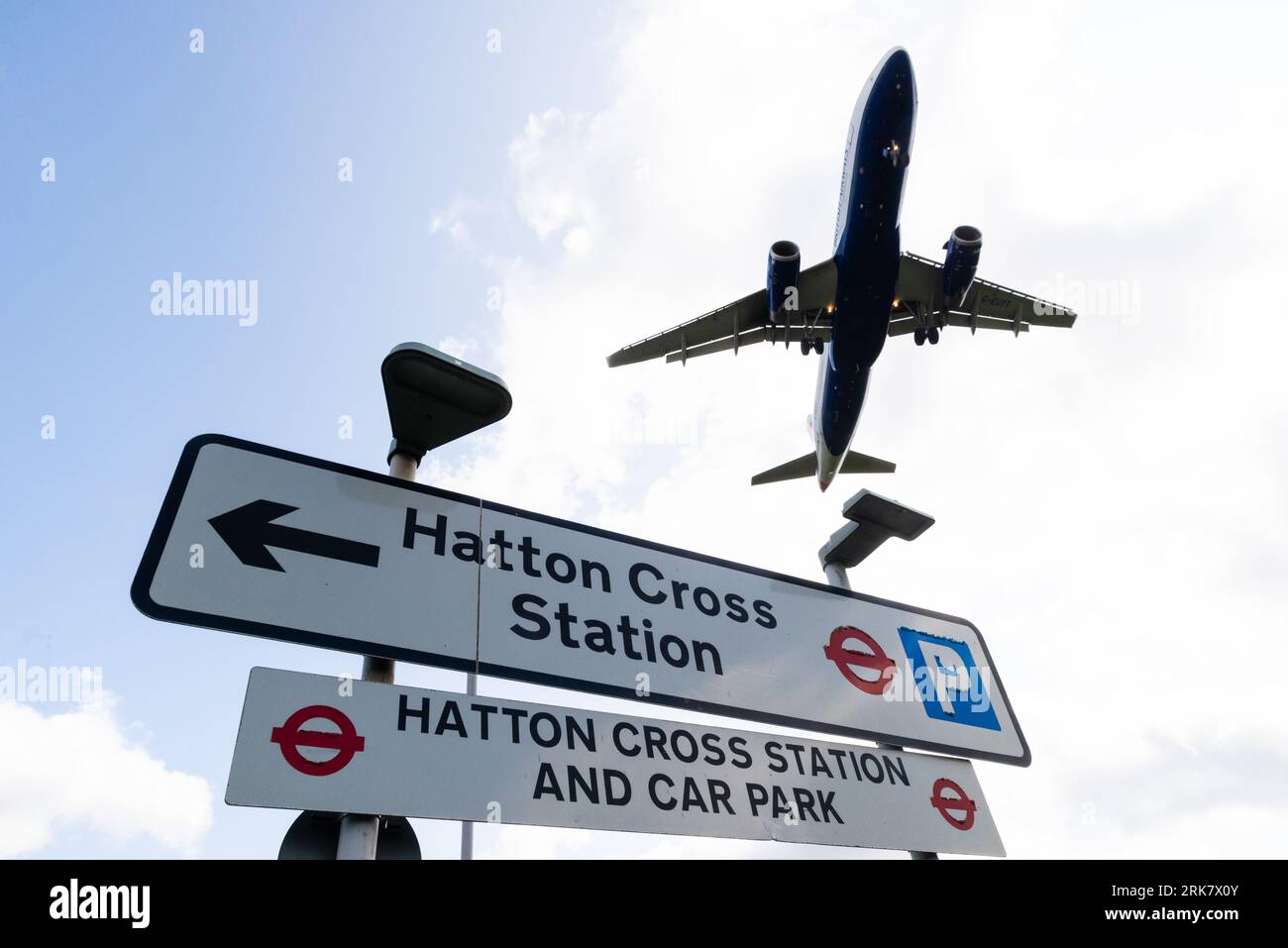 Hatton Cross station sign with jet airliner plane on finals to land at ...