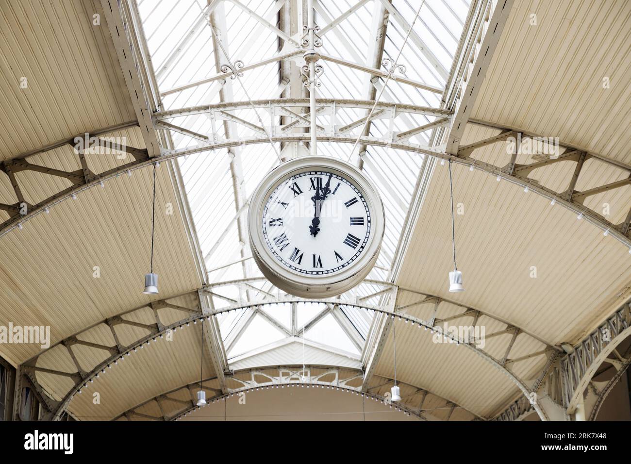 ceiling hanging clock, street round roman clock. 12:03 pm Stock Photo ...
