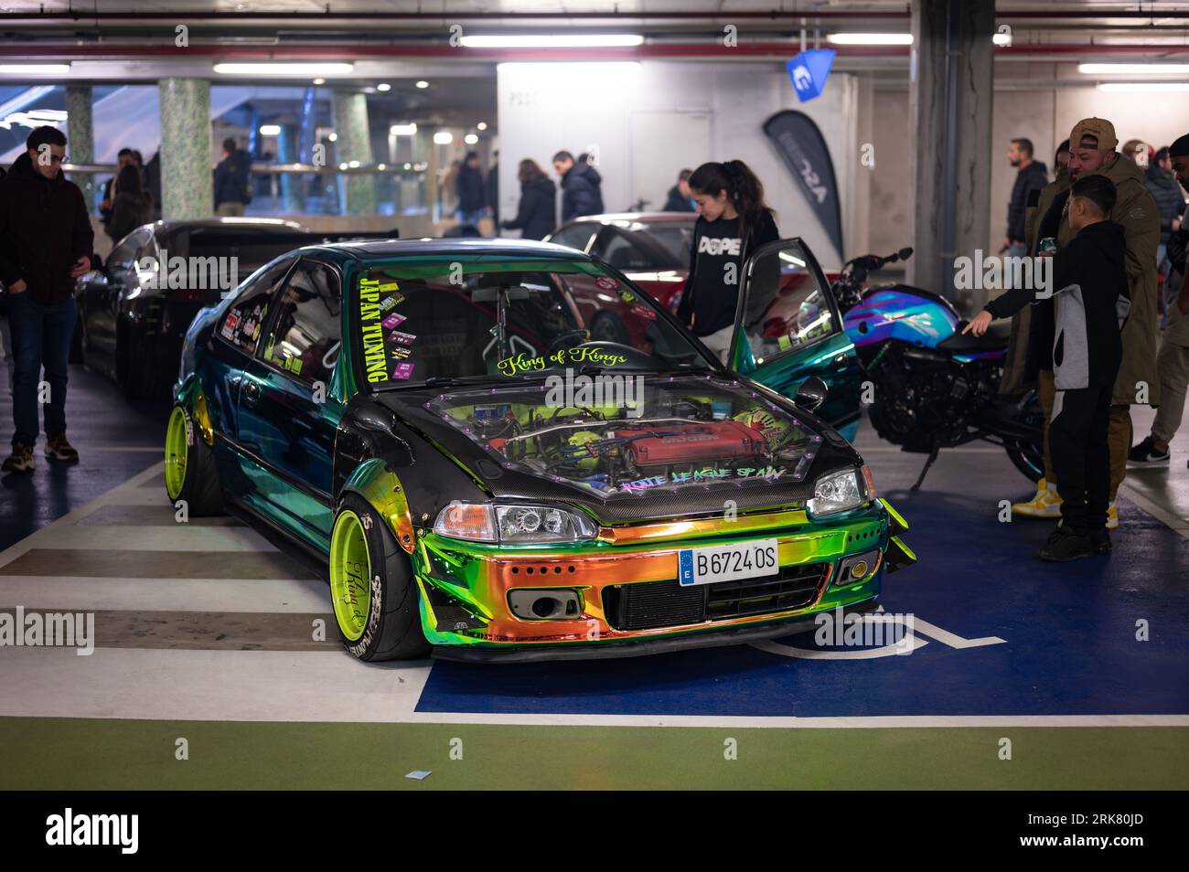 Tuned Honda Civic coupe with changeable paint, spacers and clear hood ...