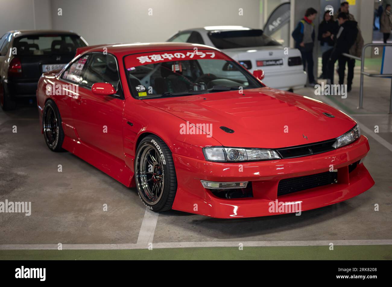 Detail of a tuned Japanese sports car, the red Nissan Silvia S14 turbo ...