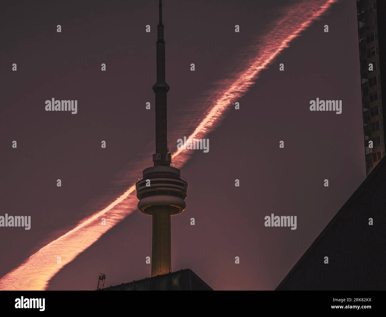 The scene features a mesmerizing purple sky, with tall black spires ...