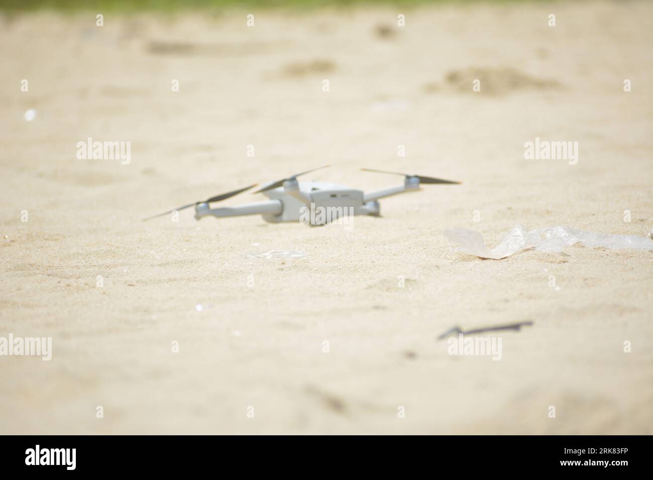 Drone landed on the beach sand Stock Photo - Alamy