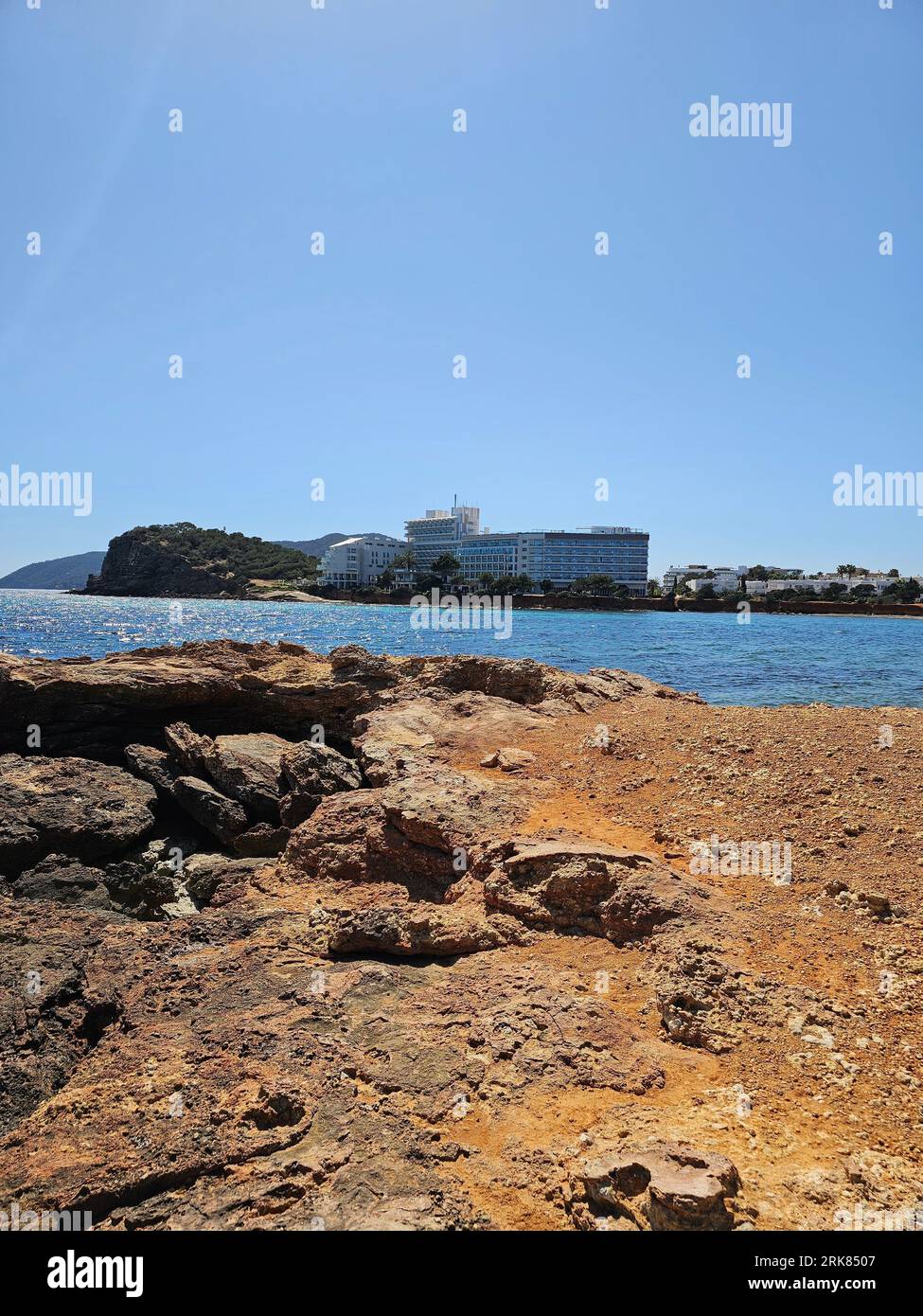 A stunning view of a shoreline with large rocks scattered across the ...
