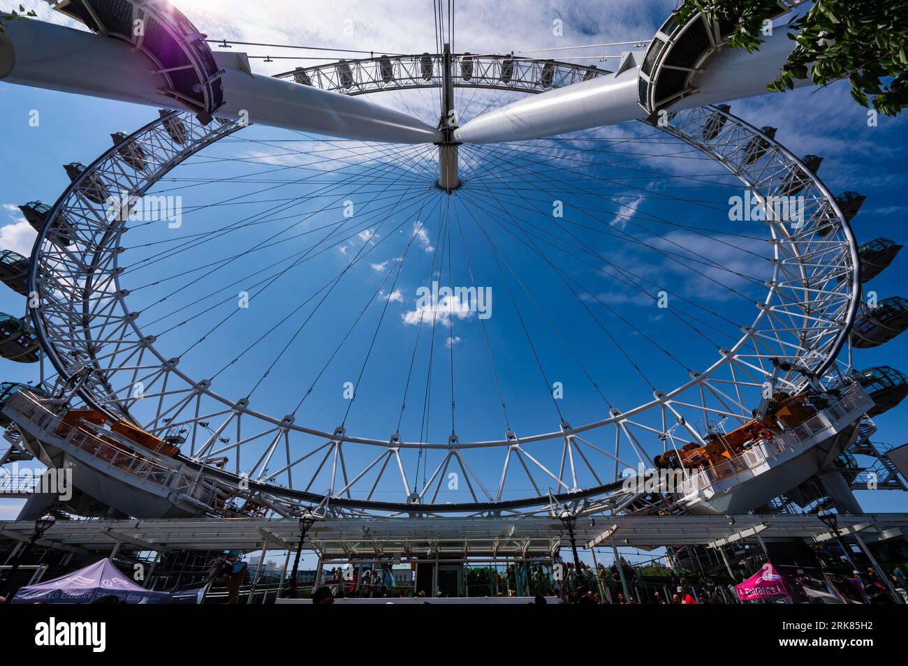 A scenic view of the London Eye, the iconic giant Ferris wheel located in the heart of London ...