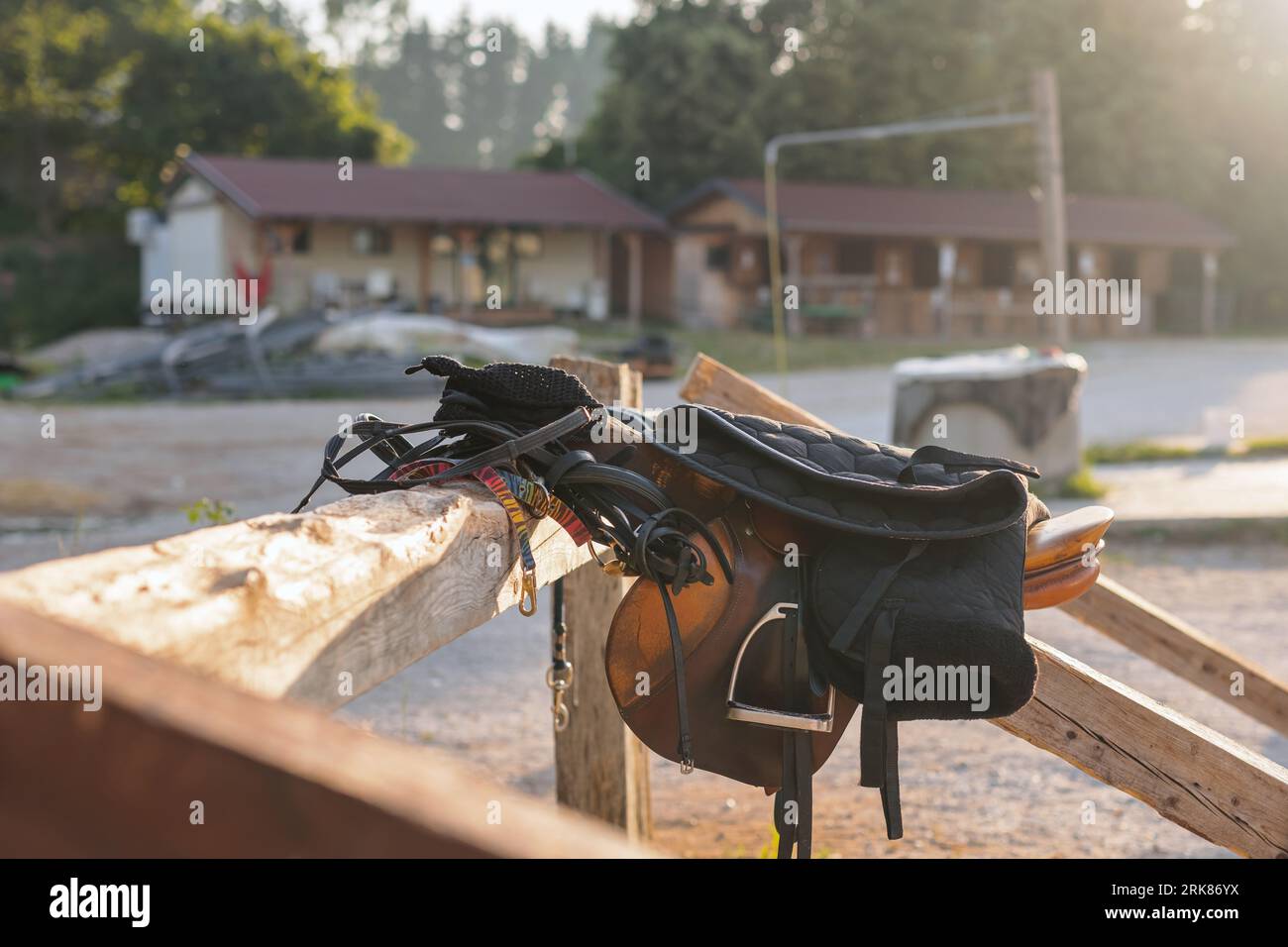 Horse saddle with stirrups on a farm outside, close up Stock Photo - Alamy