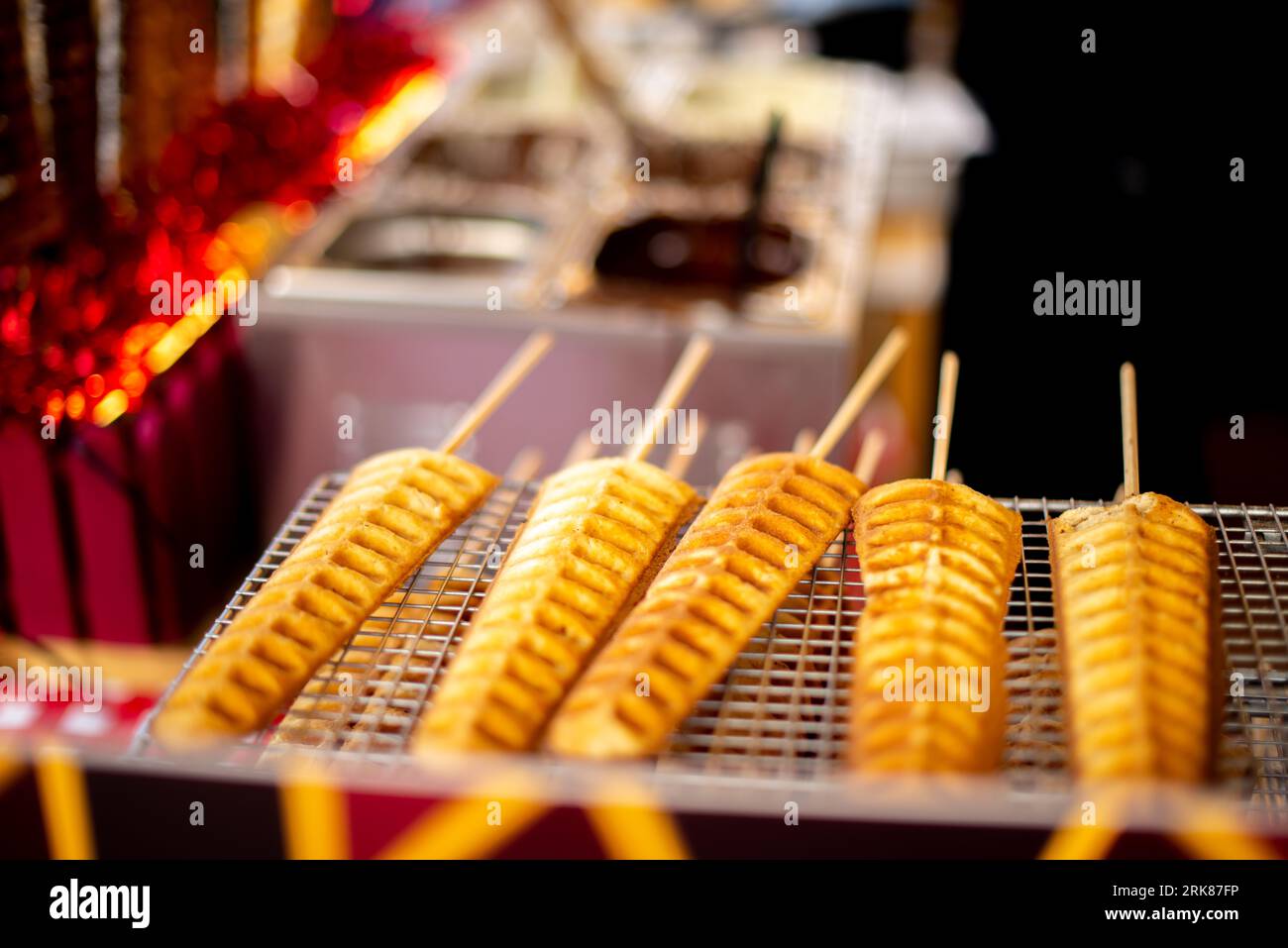 A closeup of waffles on stick in Prague, Czech republic Stock Photo - Alamy