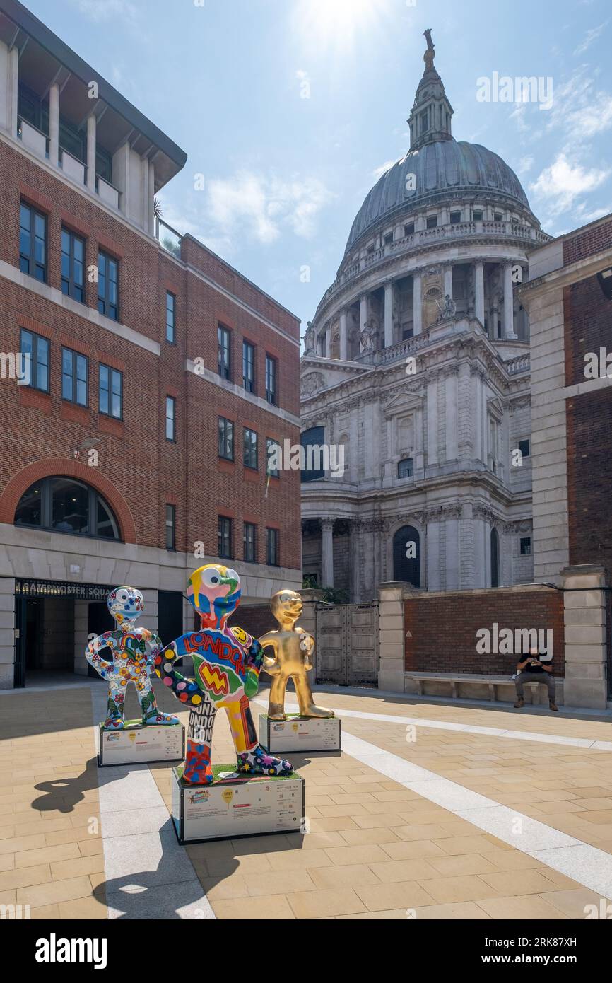 An exterior view of a large building with a unique bronze sculpture ...